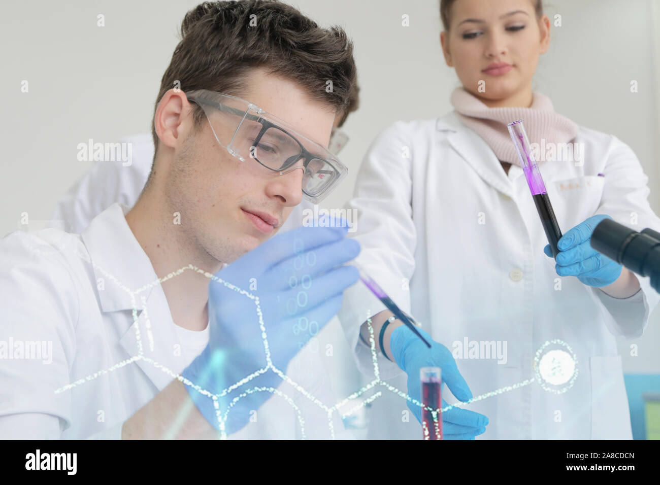 Group of young Laboratory scientists working at lab with test tubes and ...
