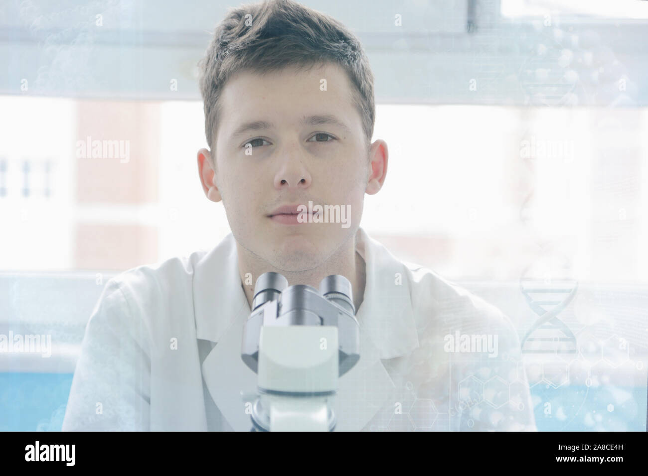 Male scientist looking and smilling into camera. Science, chemistry ...