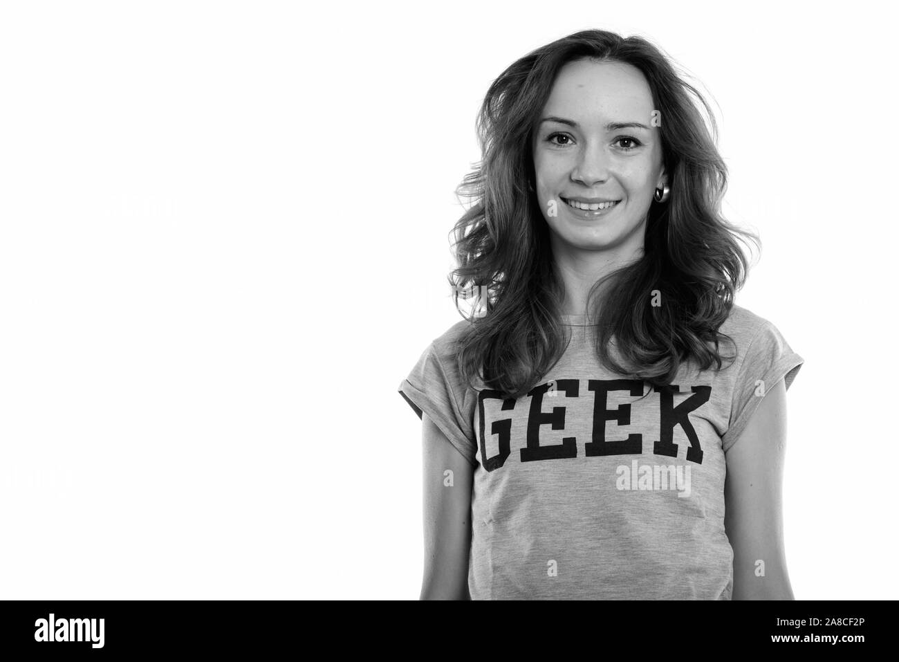 Studio shot of happy geek girl smiling Stock Photo - Alamy