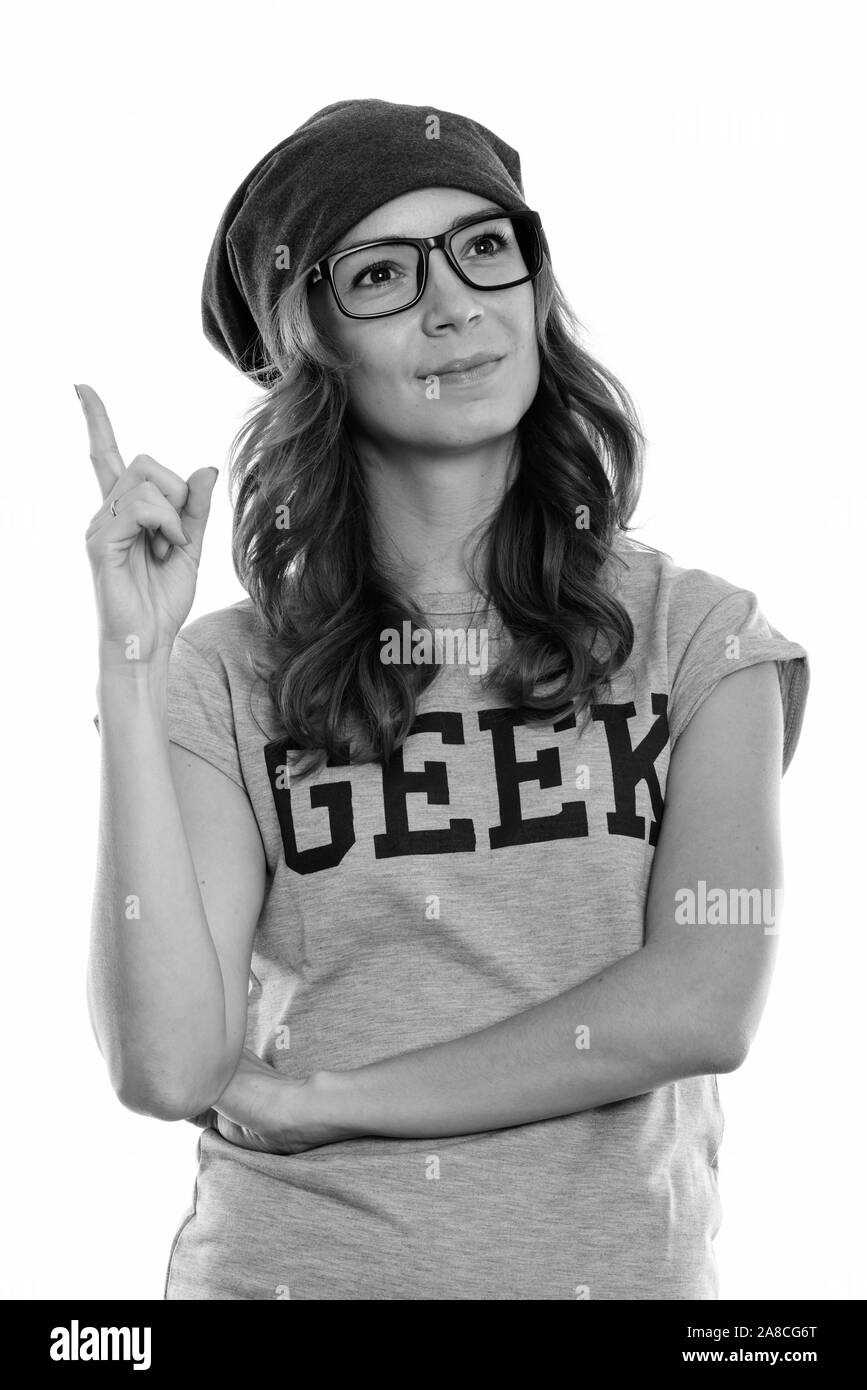 Studio shot of geek girl pointing finger up while thinking Stock Photo ...