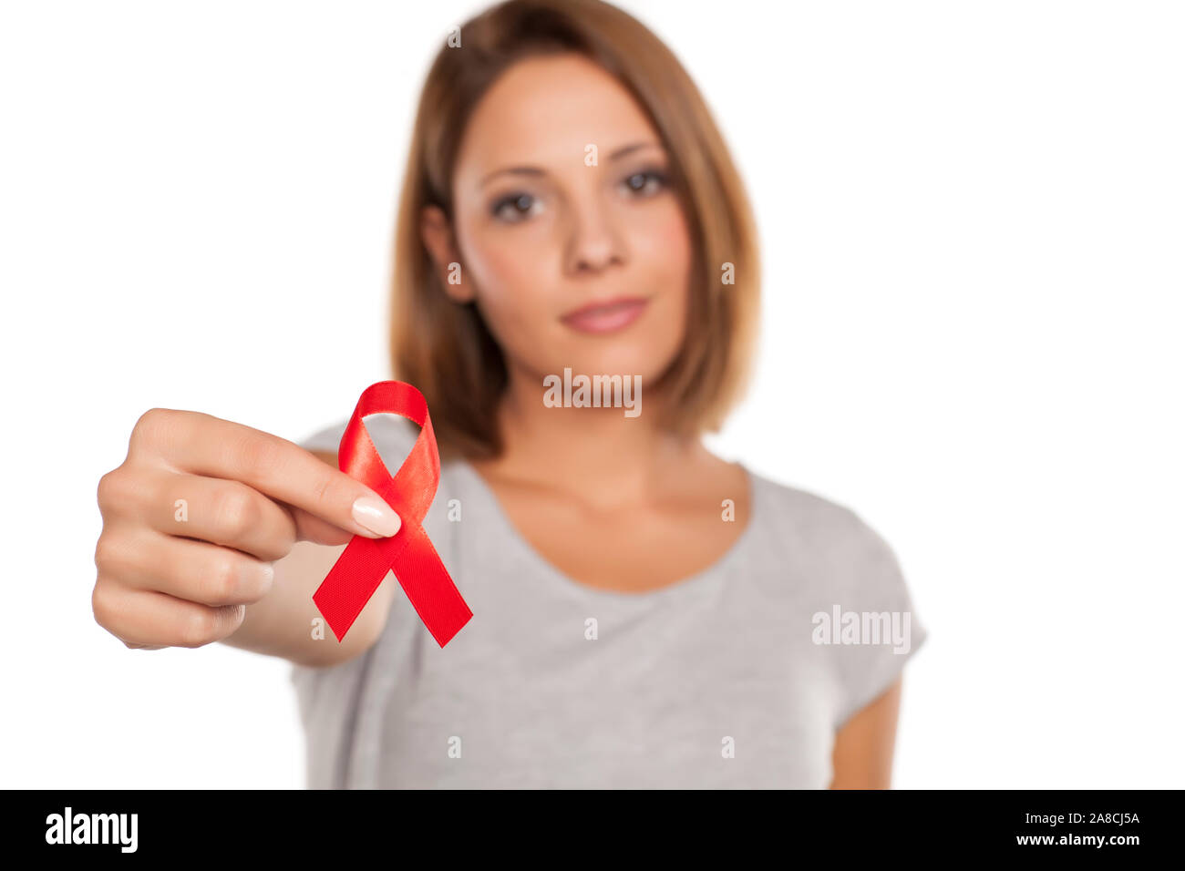 Red ribbon against aids hi-res stock photography and images - Alamy
