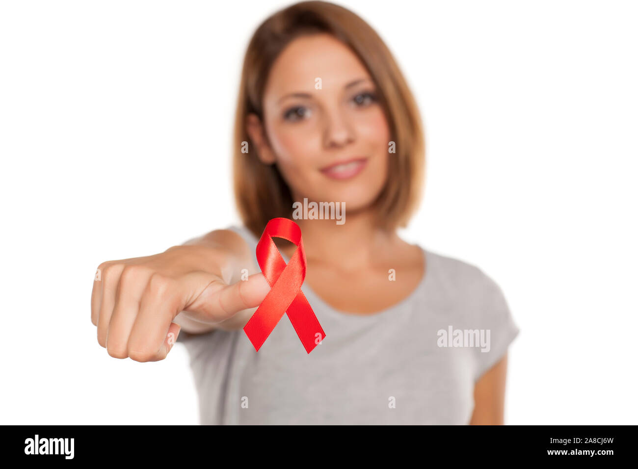 Red ribbon against aids hi-res stock photography and images - Alamy