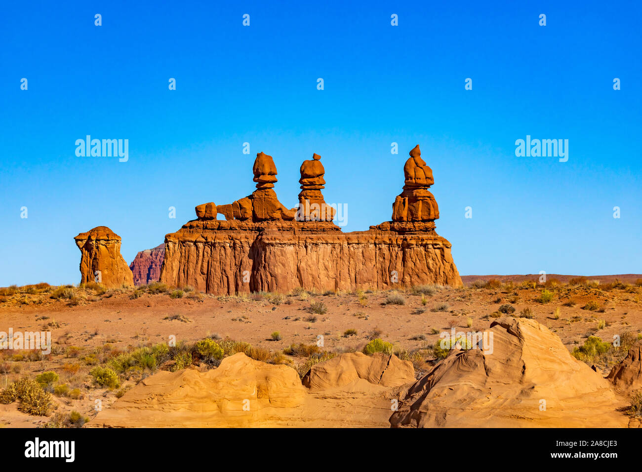 This is a view of some "Goblins" known as the Three Sisters at the entrance to Goblin Valley ...