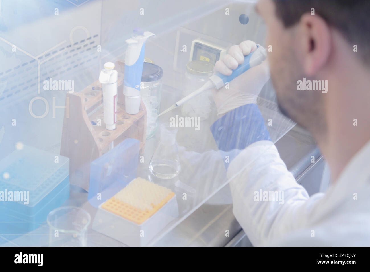 Young male Laboratory scientist working at lab with test tubes and ...