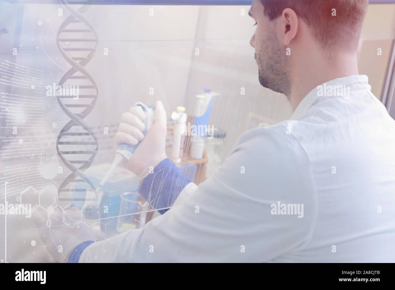Young male Laboratory scientist working at lab with test tubes and ...