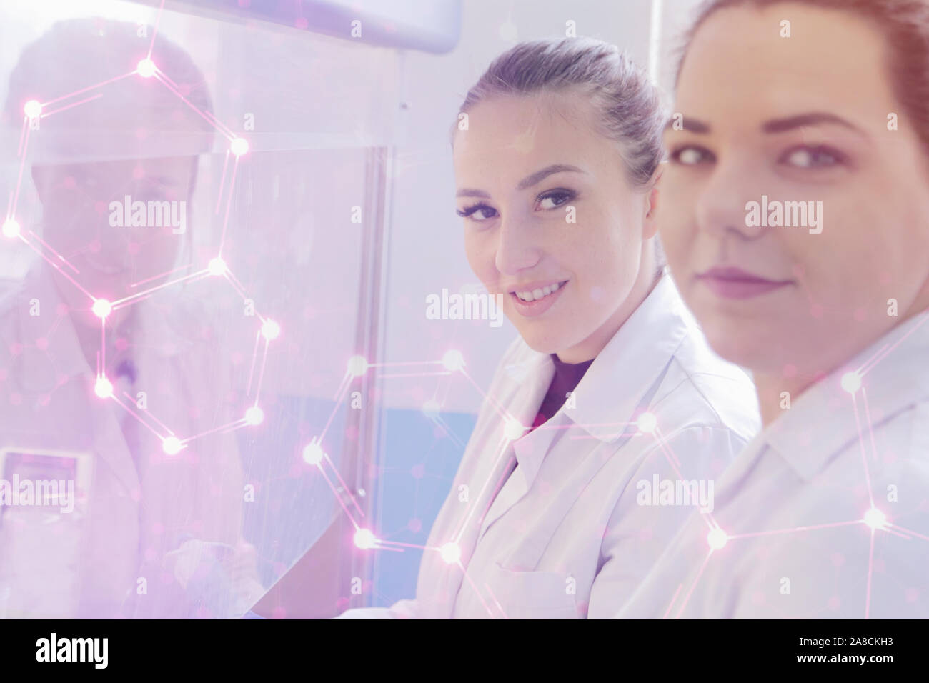 Two young female Laboratory scientists working at lab with test tubes ...