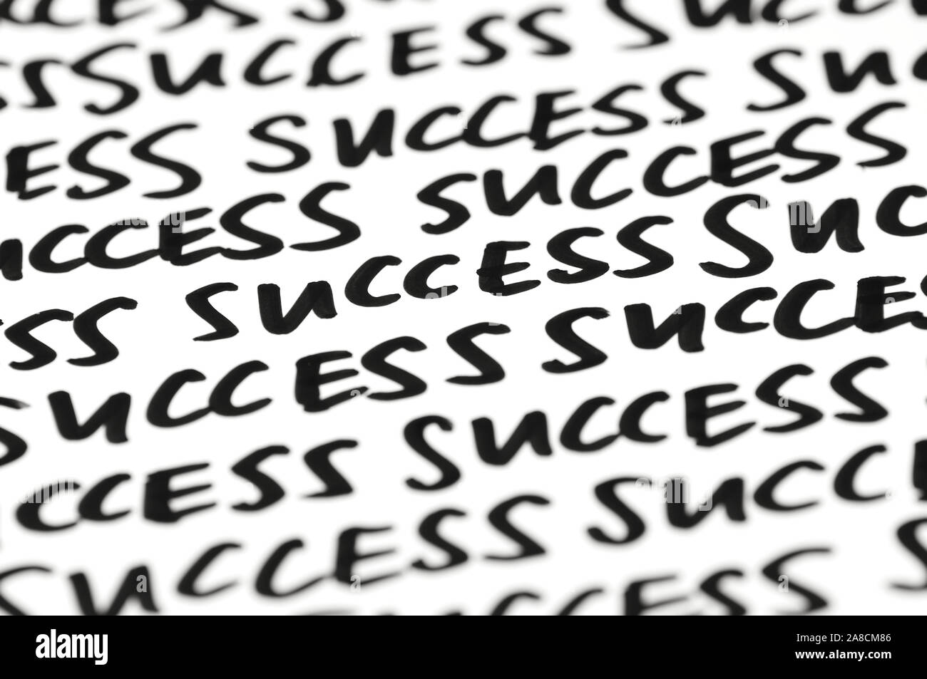 Success message written as a motivational mantra in black ink on white ...
