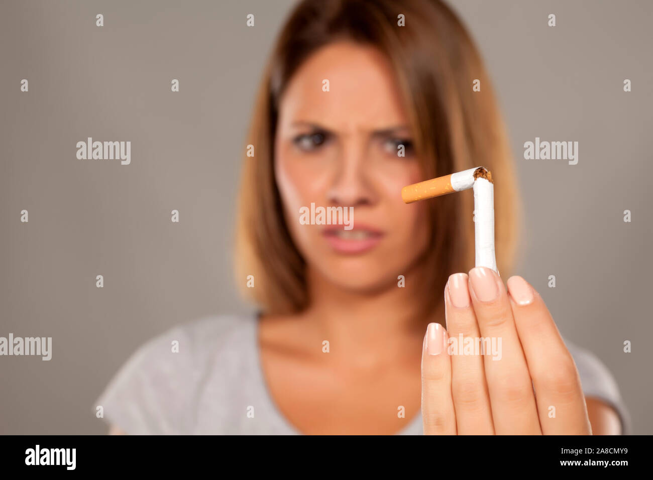 Woman smoking addict cigarette hi-res stock photography and images - Alamy