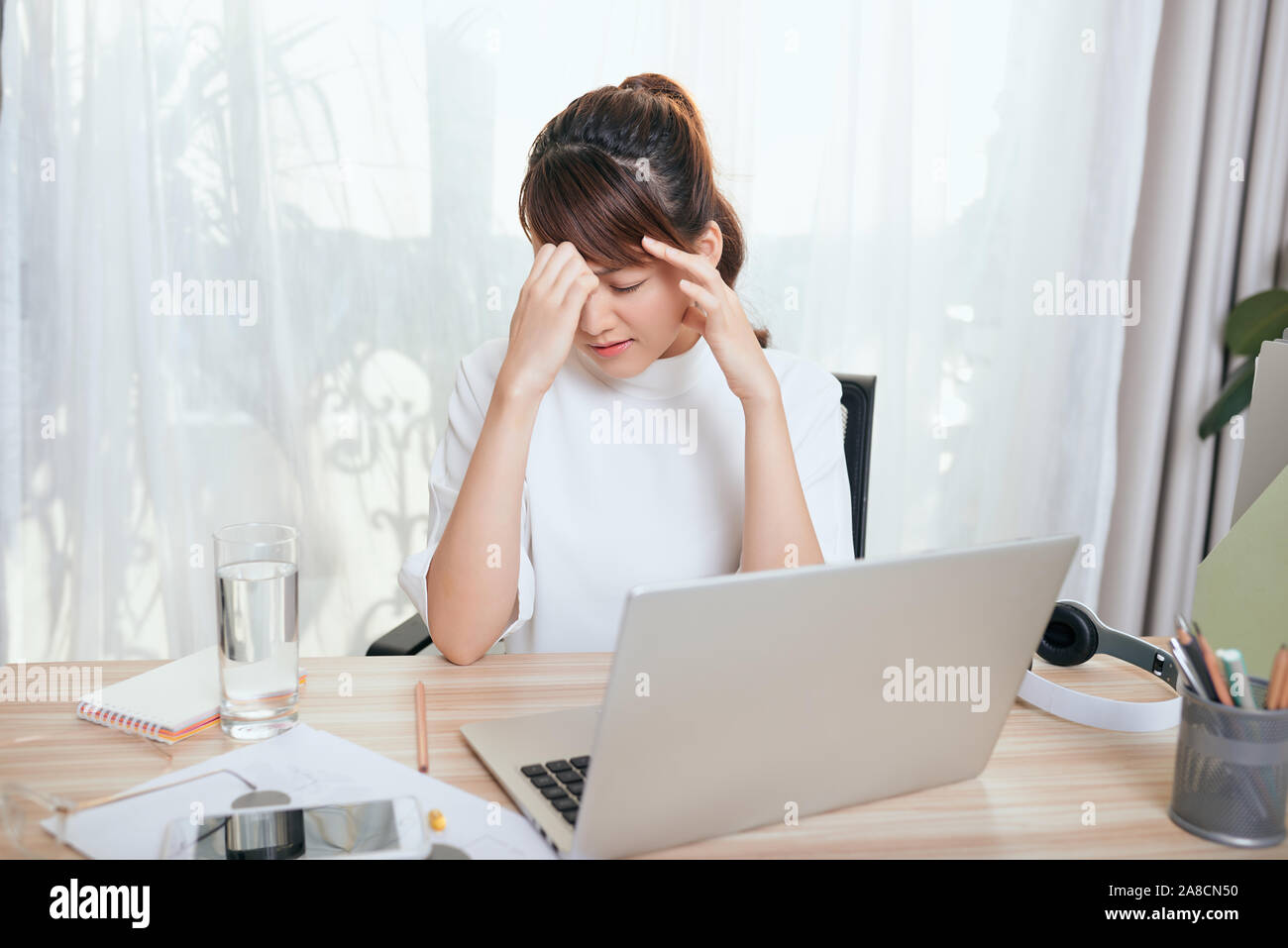 Feeling tired sitting table hi-res stock photography and images - Alamy