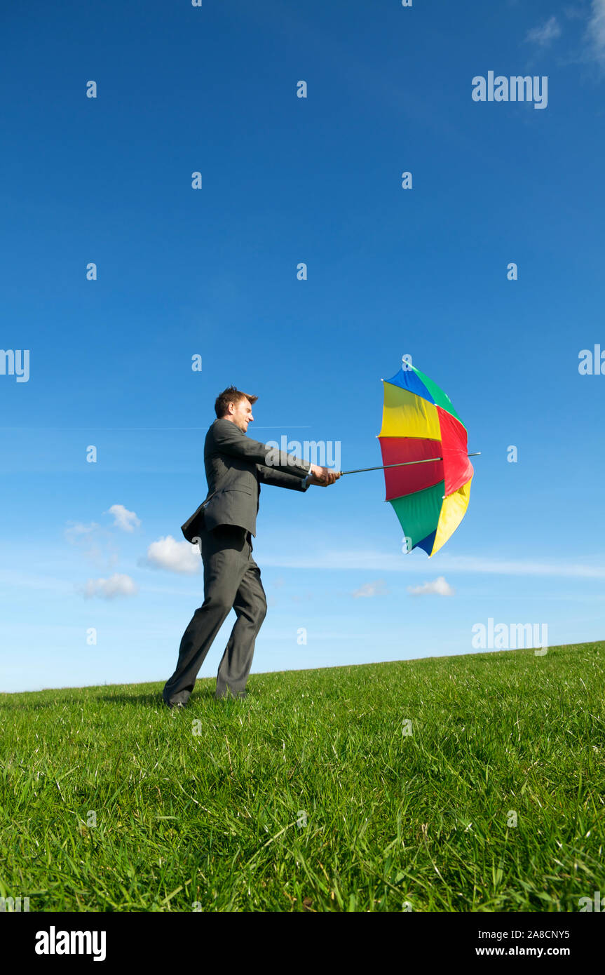 Struggling with wind hi-res stock photography and images - Alamy