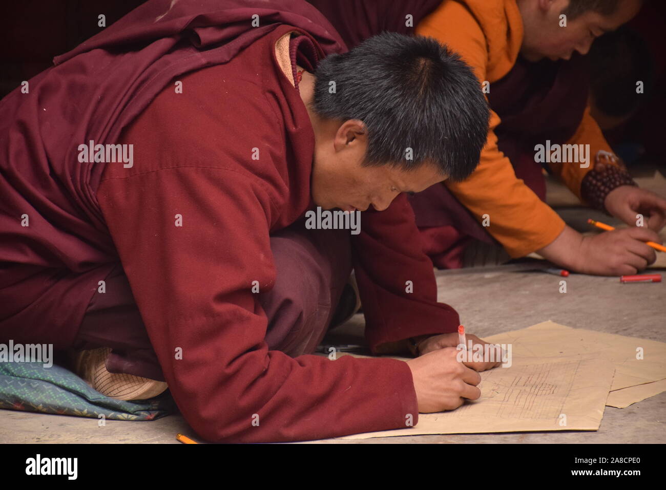 Buddhist monk practicing drawing a mandala inside Sakya monastery ...
