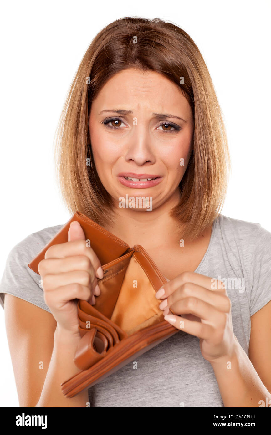 unhappy woman shows her empty wallet Stock Photo - Alamy
