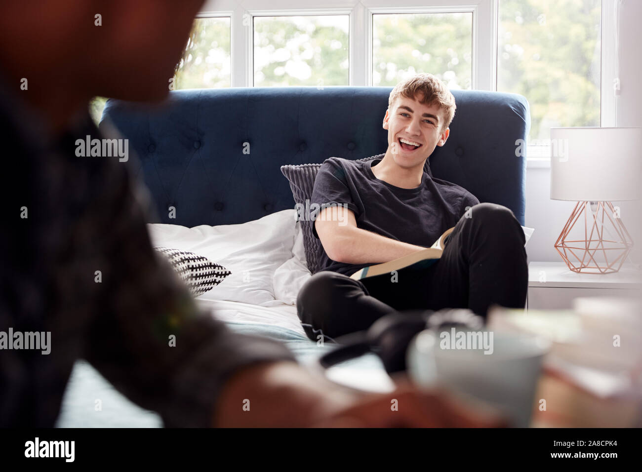 Two students talking men hi-res stock photography and images - Alamy
