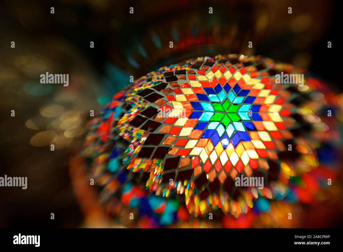 Abstract tilt-shift view of colorful Turkish lampshade in a market in ...