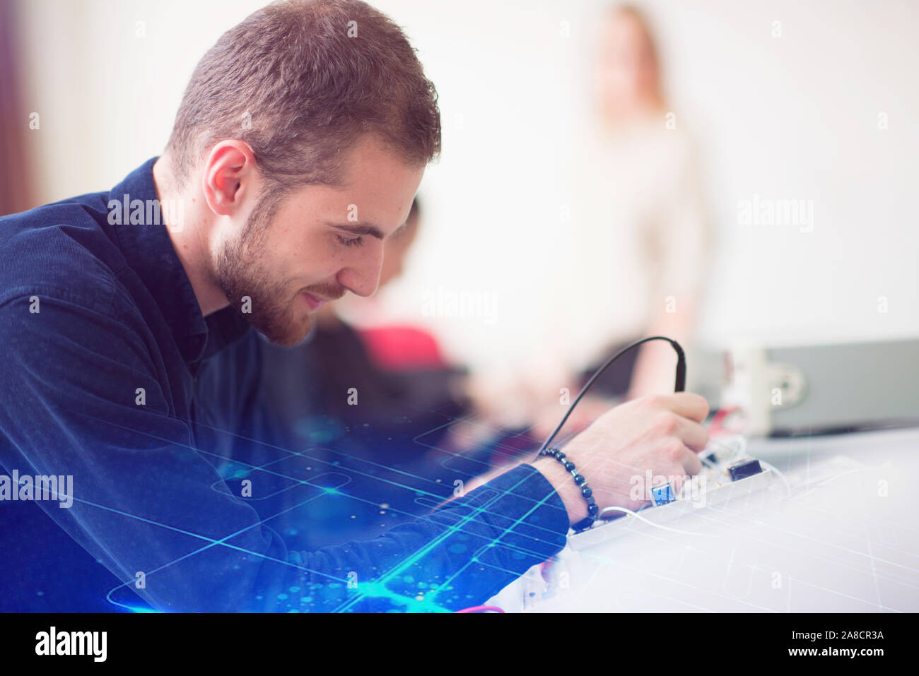 Group of young students in technical vocational training with young ...