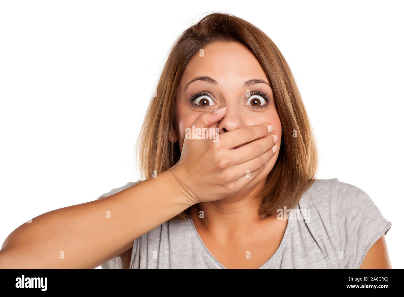 Hand over her mouth hi-res stock photography and images - Alamy