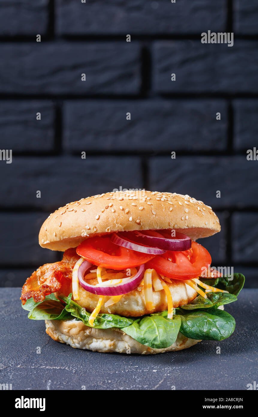 vertical view of homemade turkey burgers on buns with shredded marble ...