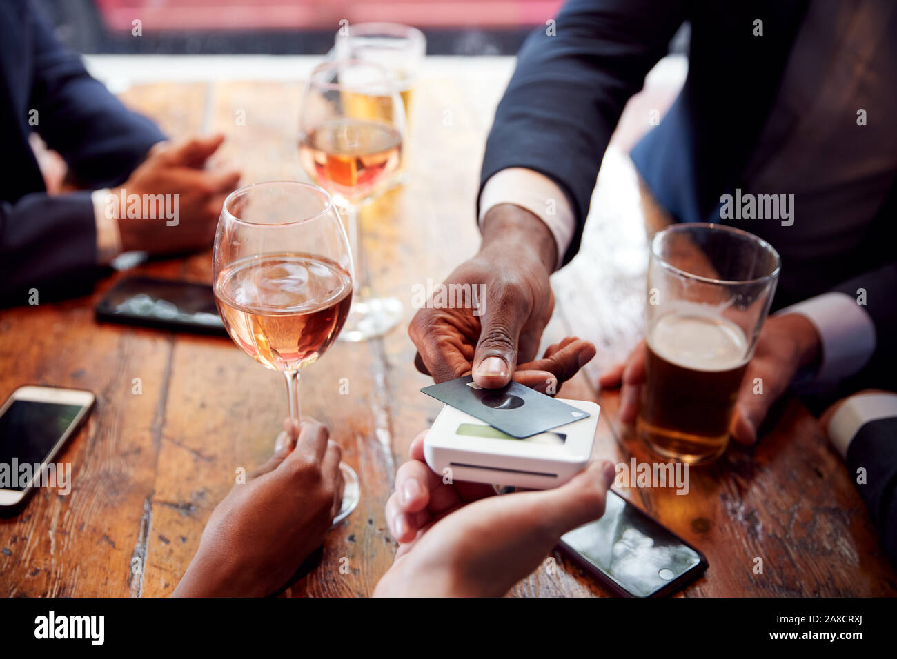 Buying a round of drinks hi-res stock photography and images - Alamy