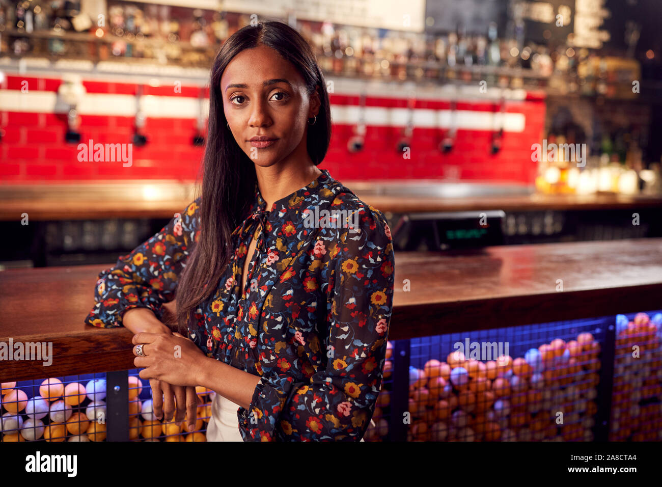 Portrait Of Female Bar Owner Standing By Counter Stock Photo - Alamy