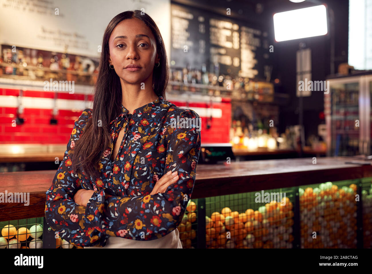 Portrait Of Female Bar Owner Standing By Counter Stock Photo - Alamy
