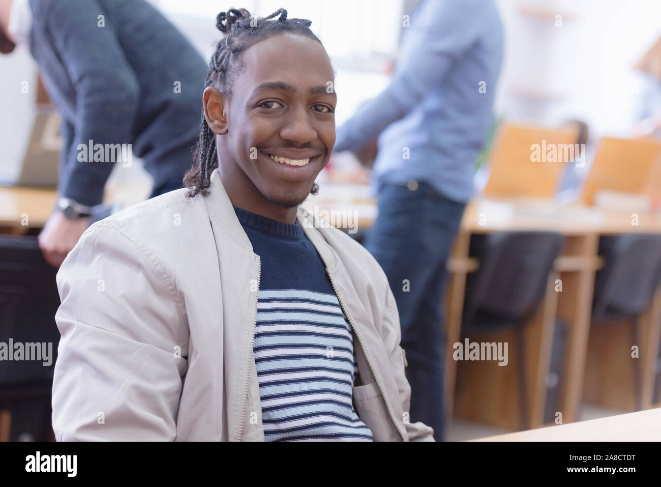Male african american university student work at computer lab at ...