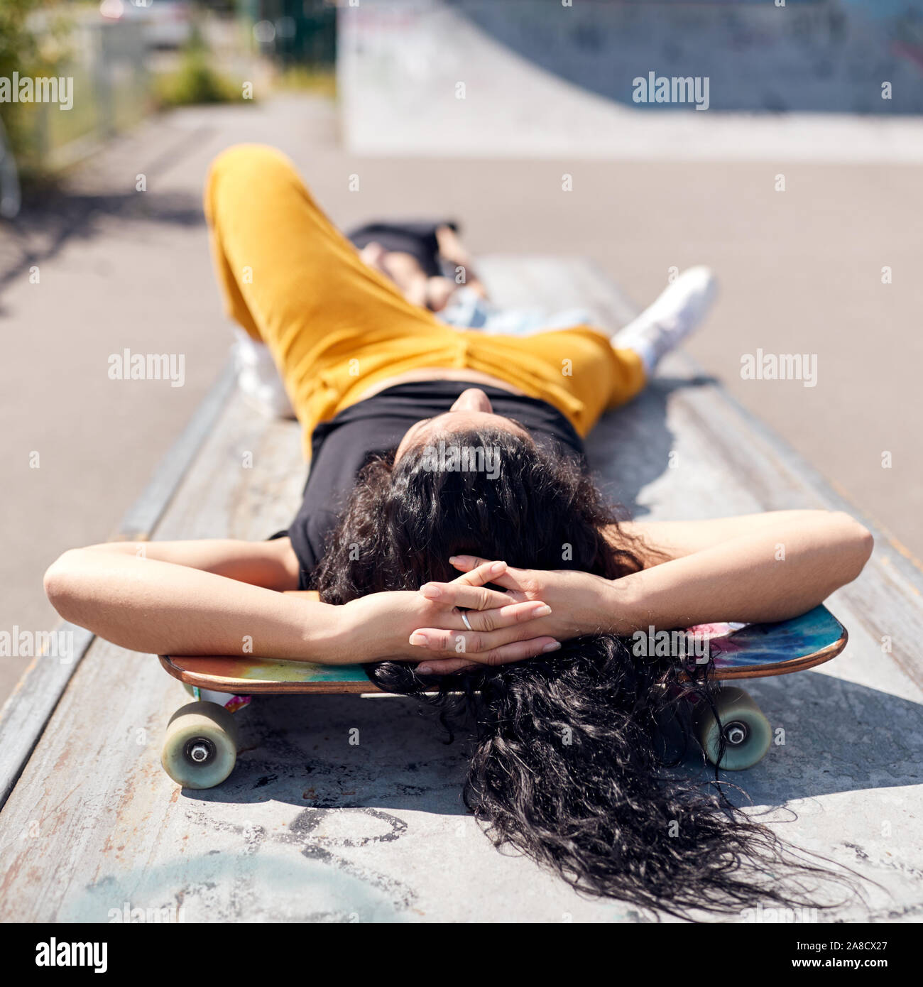 Lying on skateboard hi-res stock photography and images - Alamy