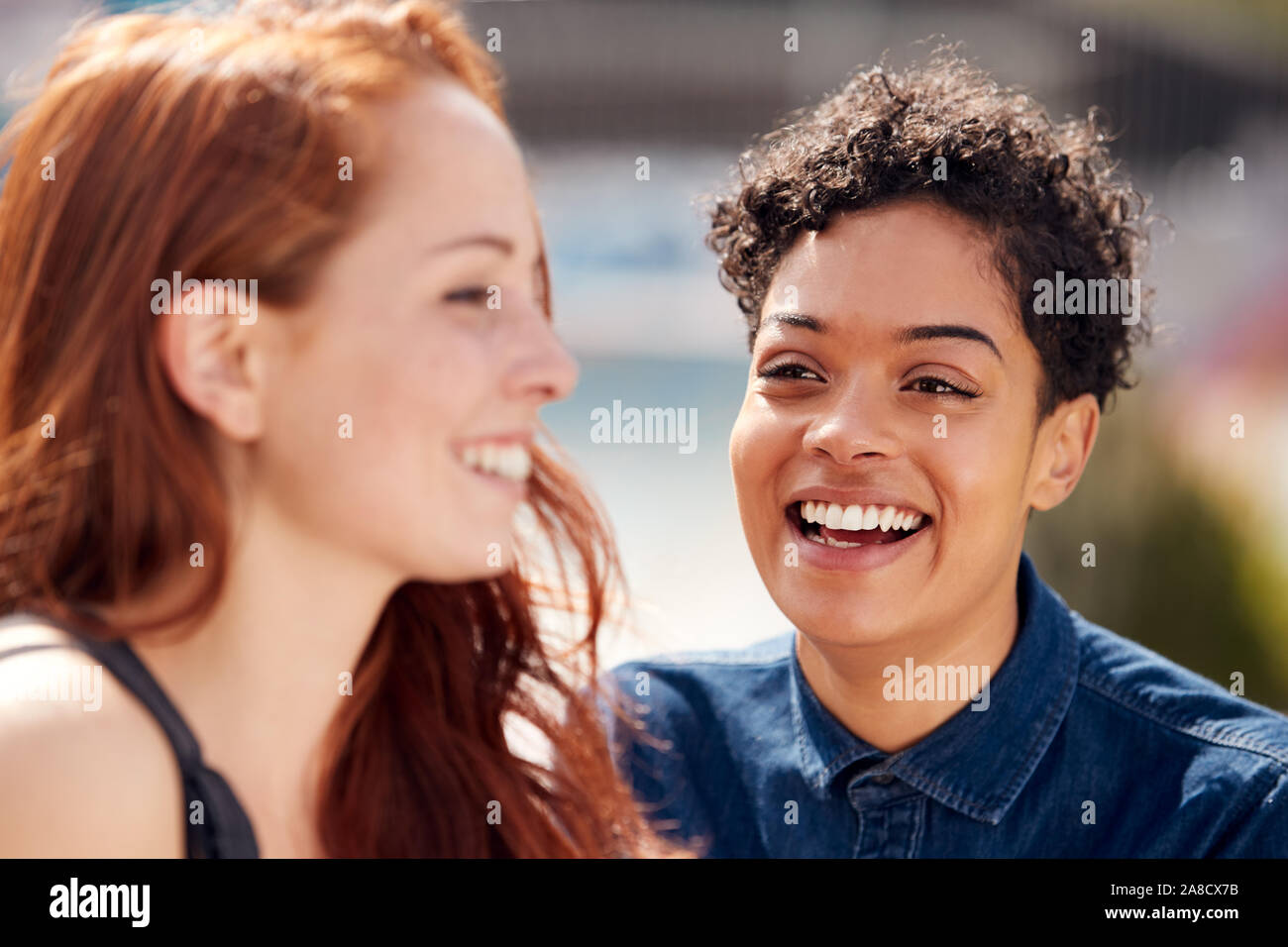 Two Female Friends Meeting In Urban Skate Park Stock Photo - Alamy