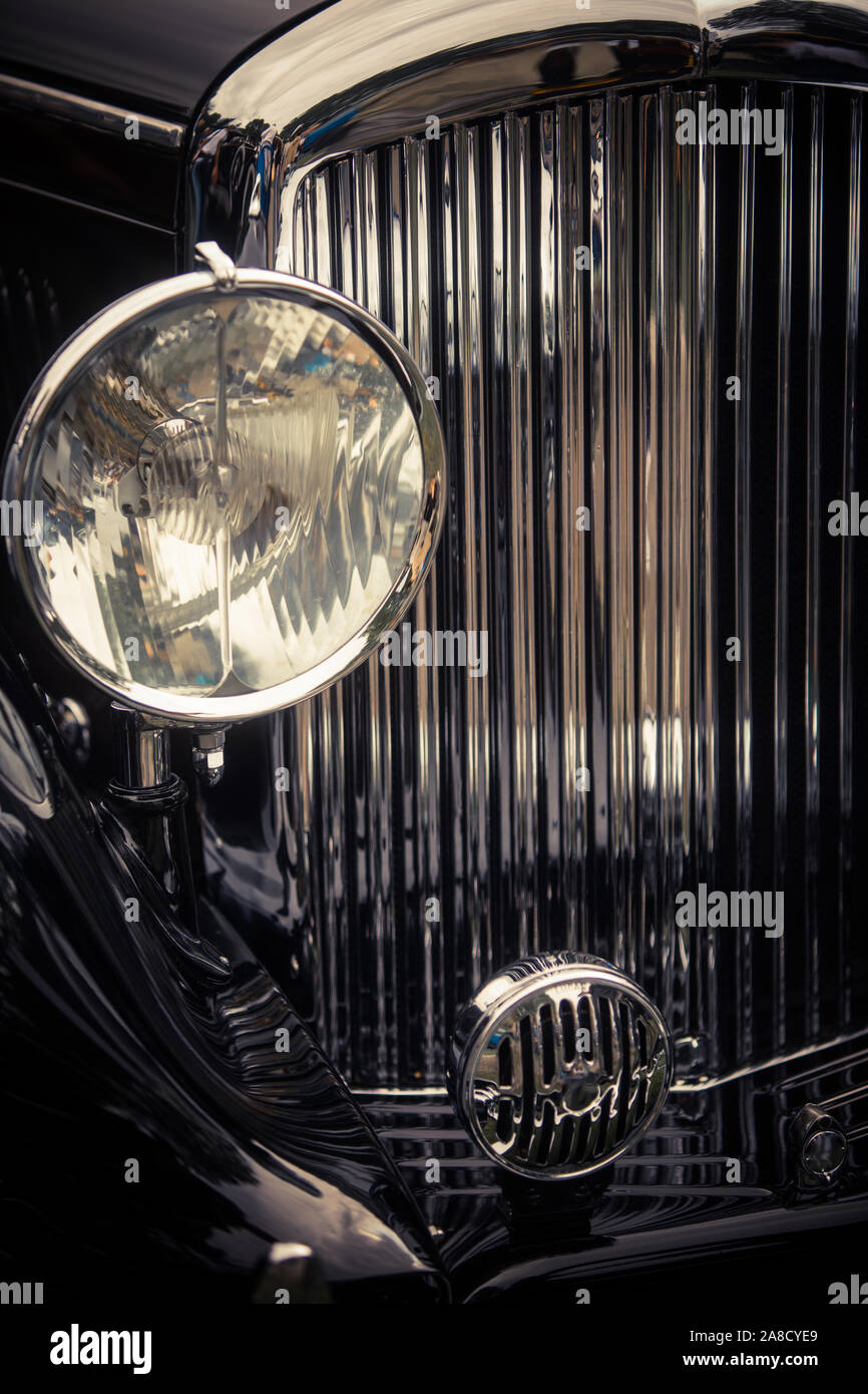 Close up vertical image of the headlight of a vintage classic car Stock ...