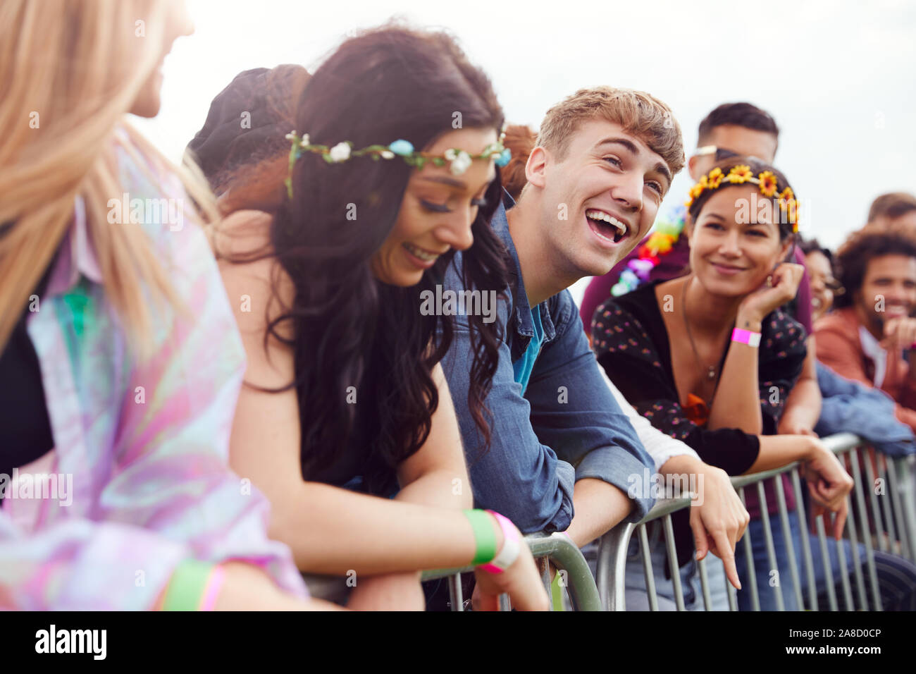 People waiting behind barrier hi-res stock photography and images - Alamy