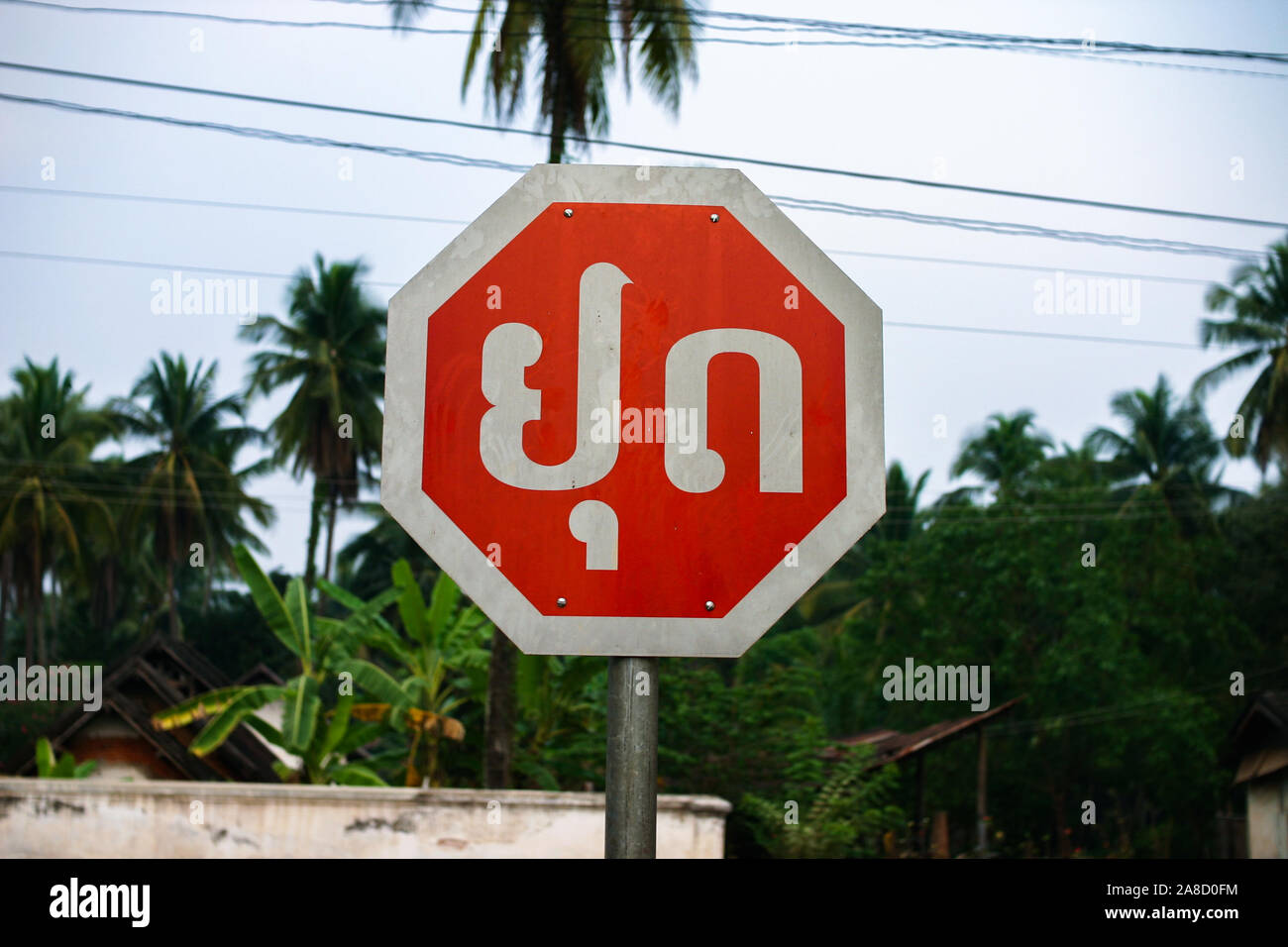 Stop sign in Lao Stock Photo - Alamy