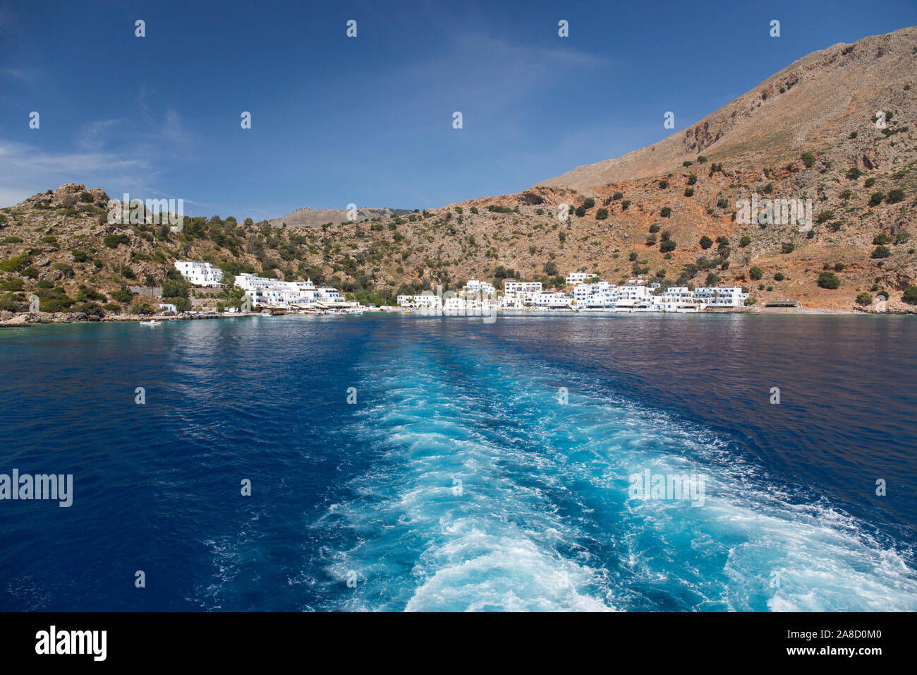 Loutro, Chania, Crete, Greece. View to the village from departing ferry ...