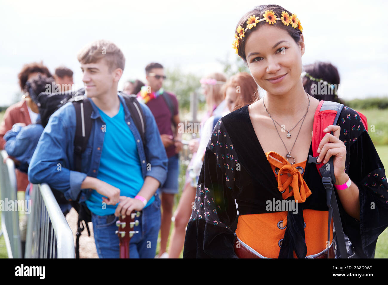 Portrait Of Young Woman Waiting Behind Barrier At Entrance To Music ...