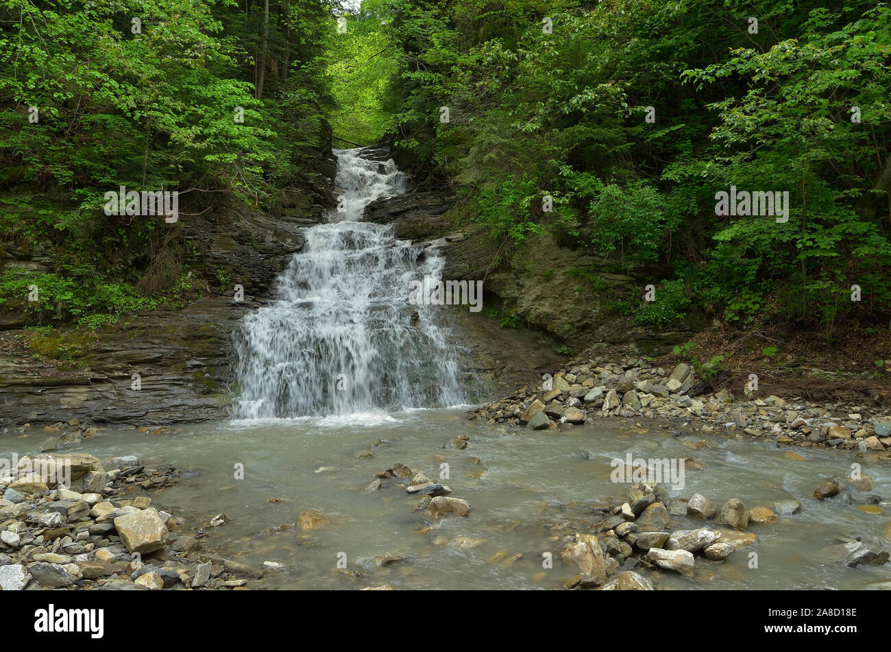 Spring landscape with mountain waterfall Stock Photo - Alamy
