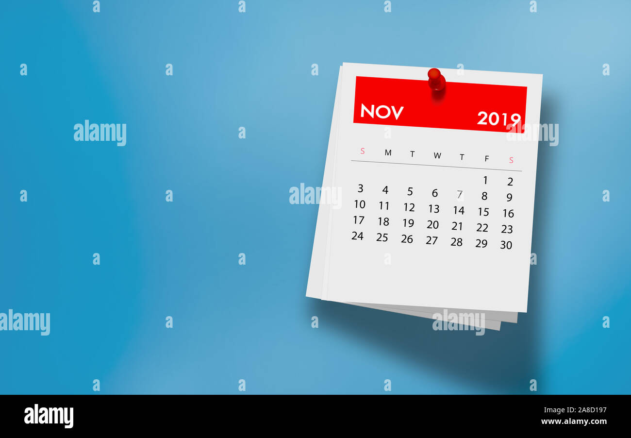 November 2019 calendar on a white note paper pinned on wall against ...