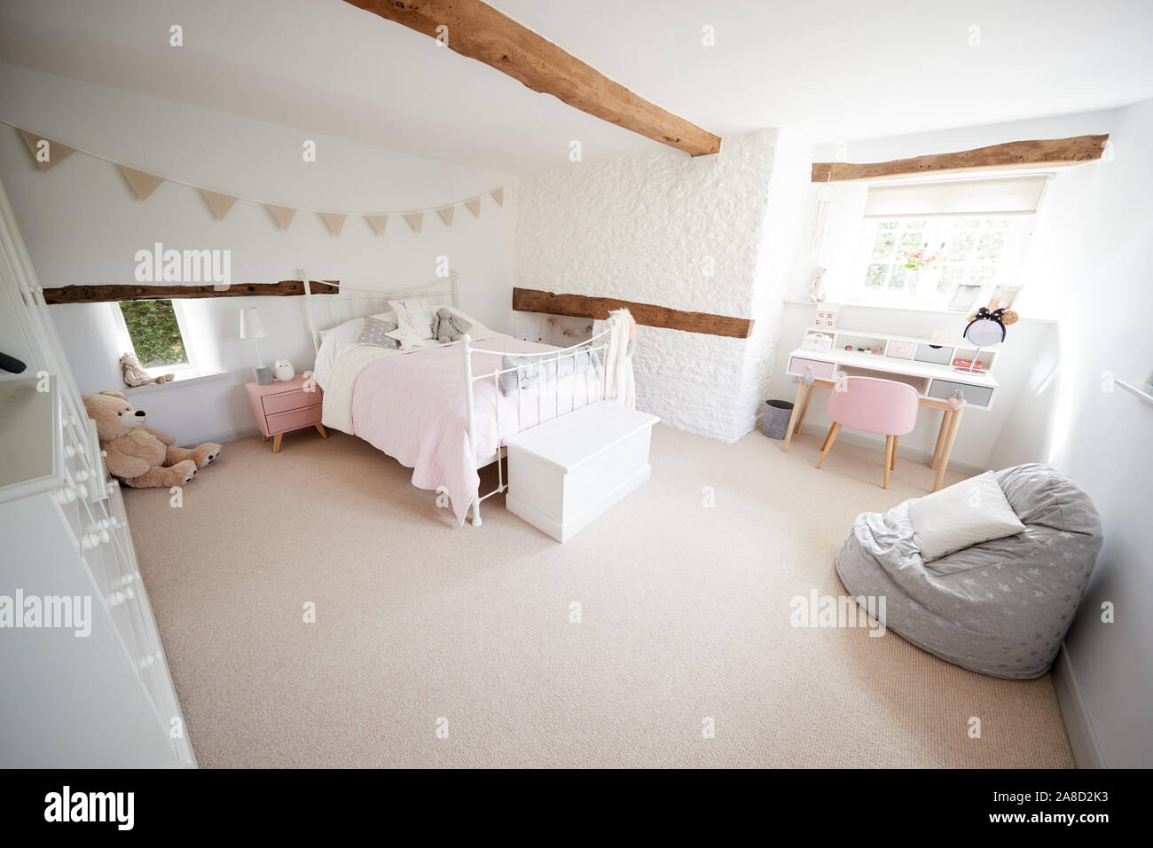 Empty Interior Of Young Girls Bedroom With Desk And Storage Stock Photo ...
