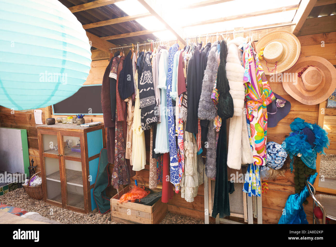 Vintage Clothing In Communal Room On Glamping Camp Site Stock Photo - Alamy