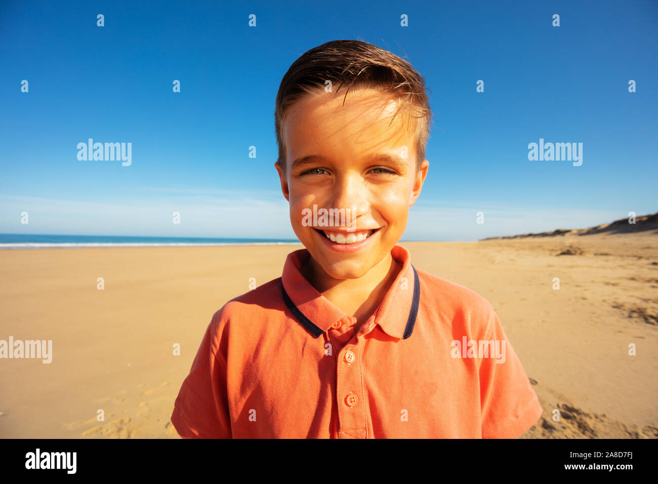 Head and shoulders portrait of boy smile on beach Stock Photo - Alamy