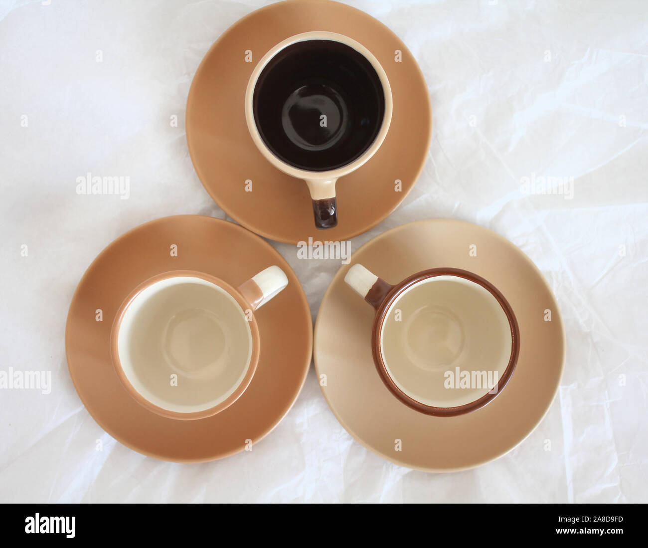 Three empty coffee cups. Top view Stock Photo - Alamy