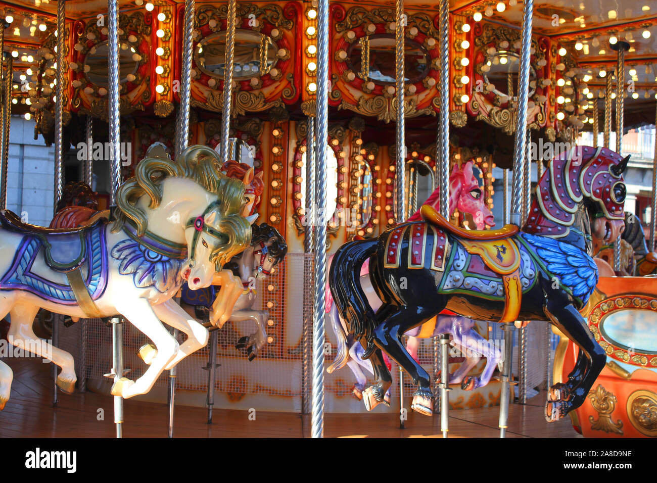Old fashioned carousel horses in Madrid Stock Photo - Alamy