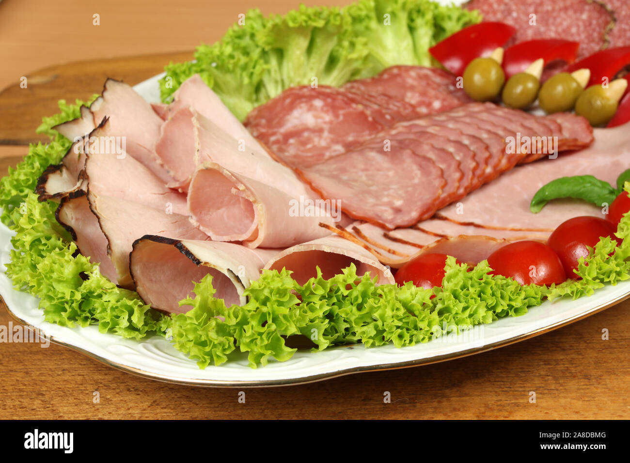 Party banquet plate with cold cuts of polish ham and sausage ...