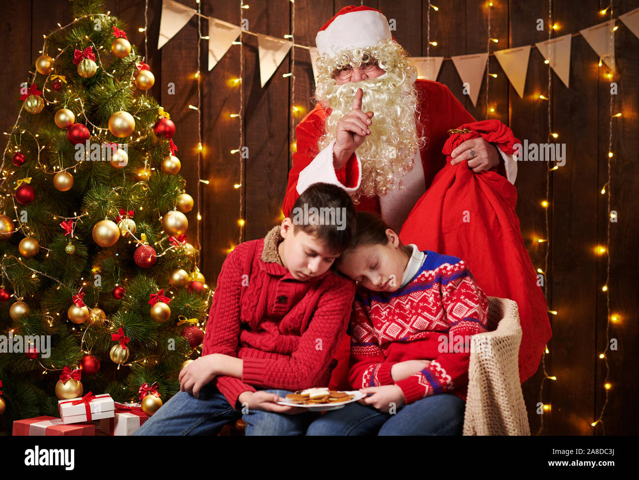 The children waited a long time for Santa, now they fell asleep and ...