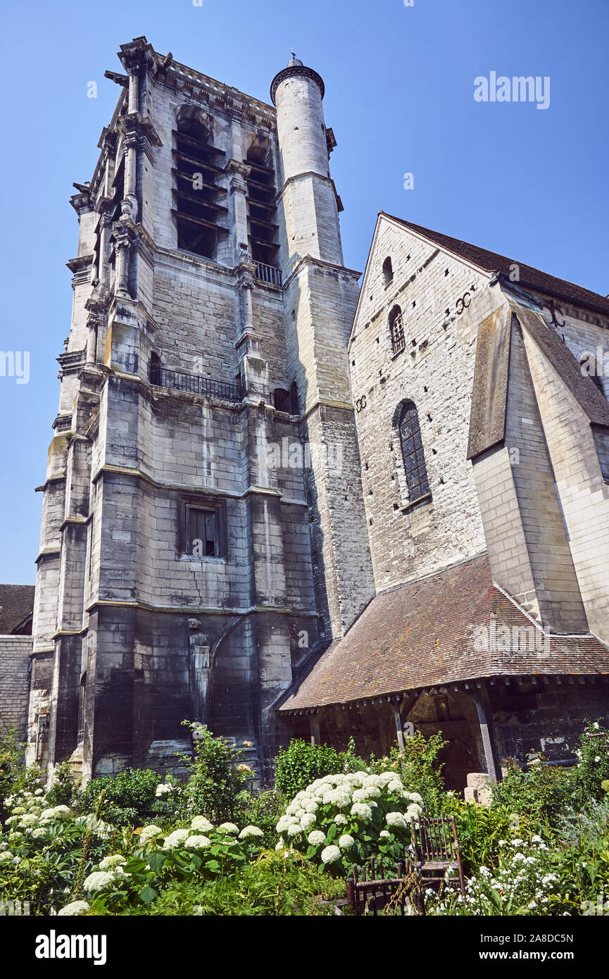 Garden with a medieval historic church in the city of Troyes, France ...