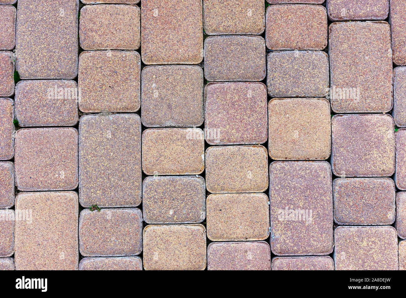 Light brown stone pavement in full frame with square and rectangular ...