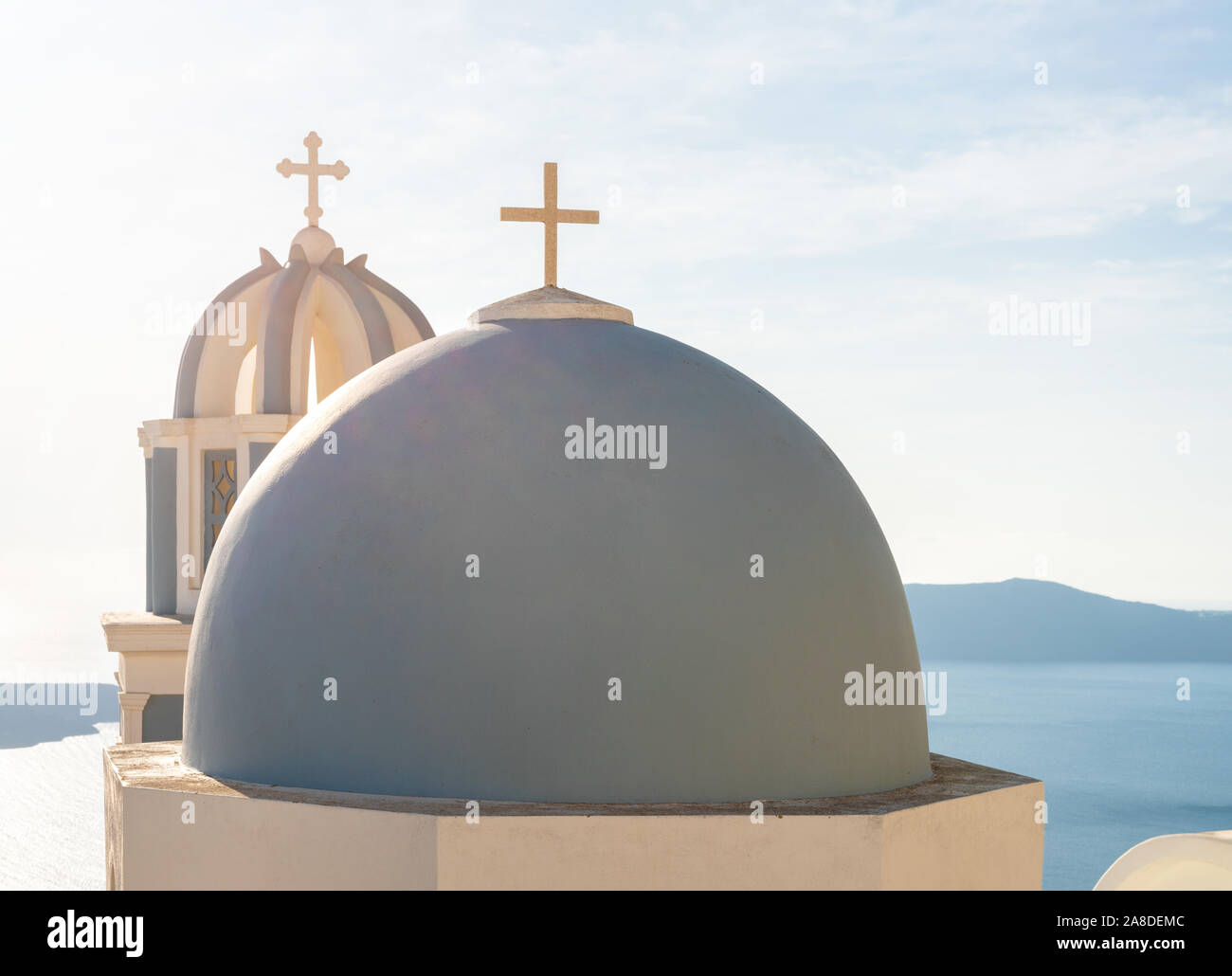 Classical orthodox Greek church blue dome and bell tower in Santorini ...