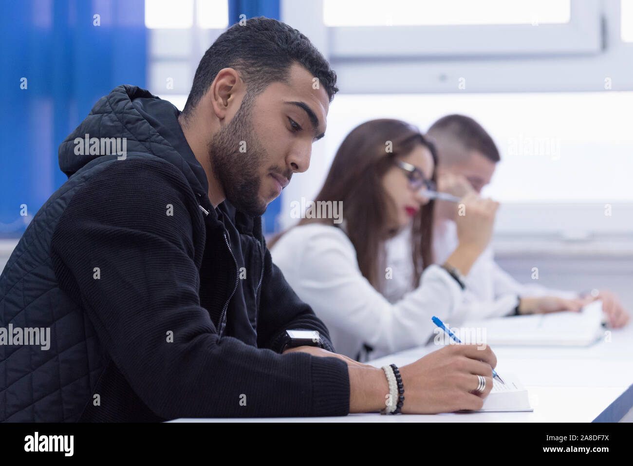 University Students during the class. Resolving problems together. Team ...
