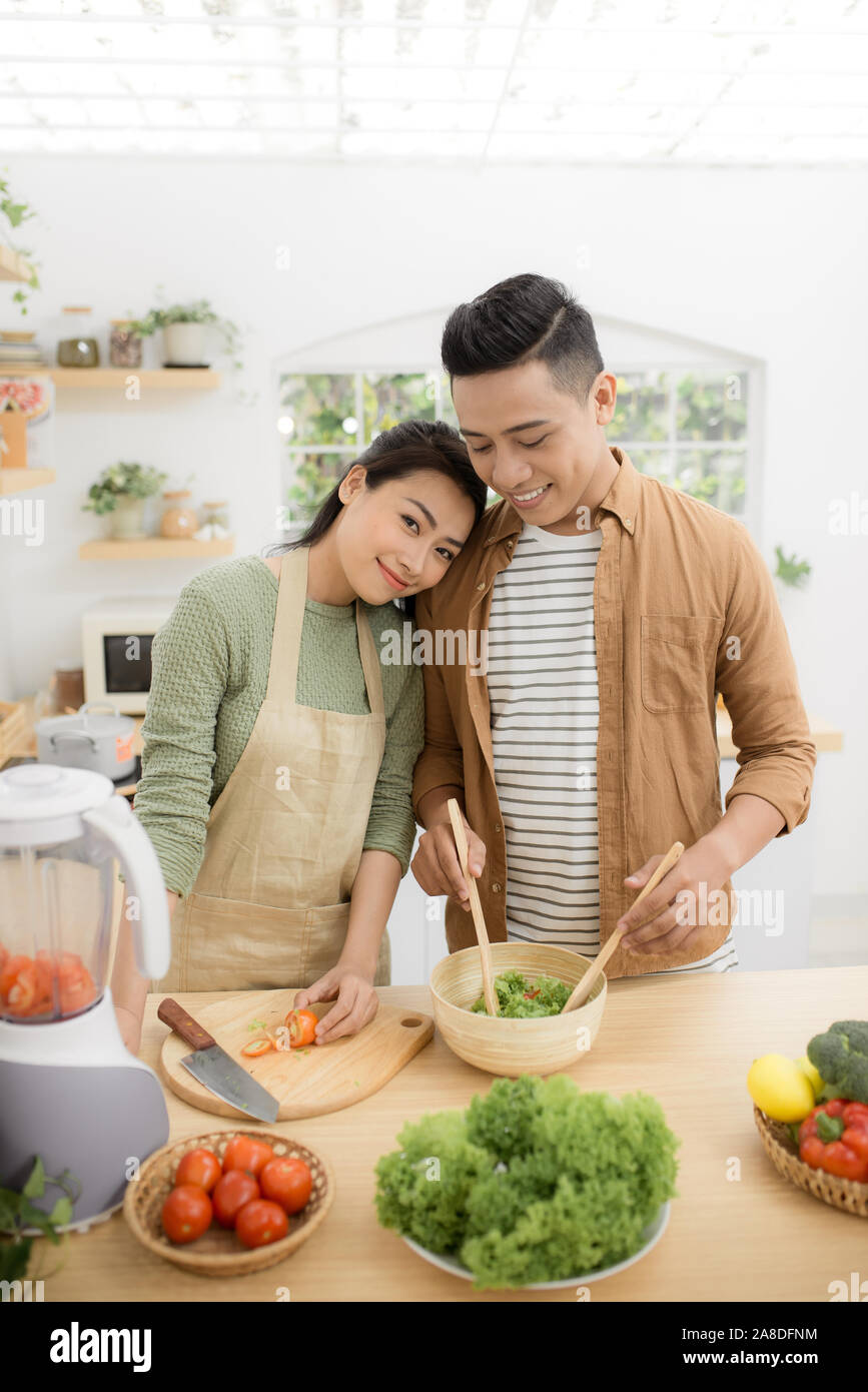 Young asian man and woman have romantic time while staying at home ...