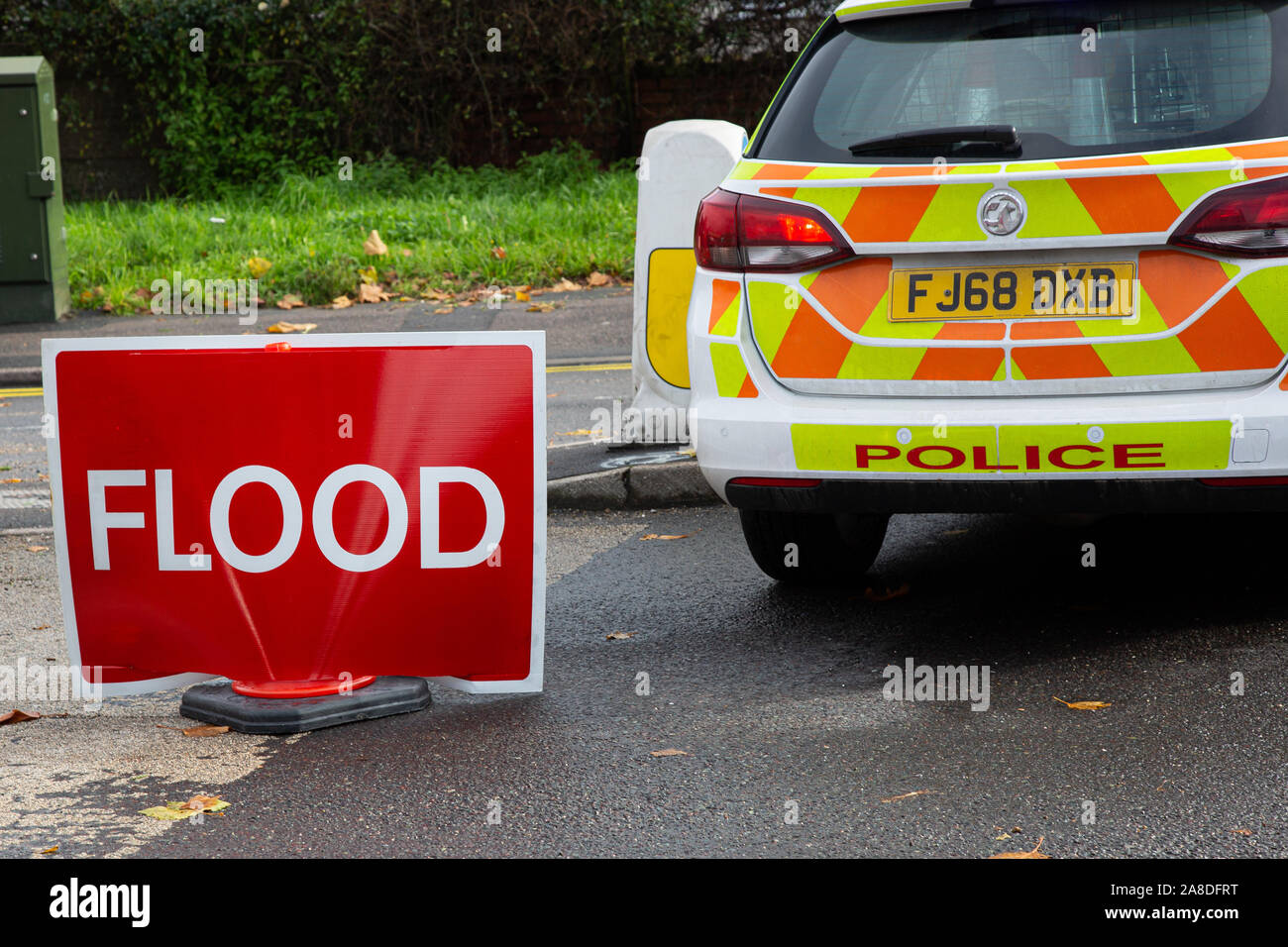 Flood sign with police car Stock Photo - Alamy