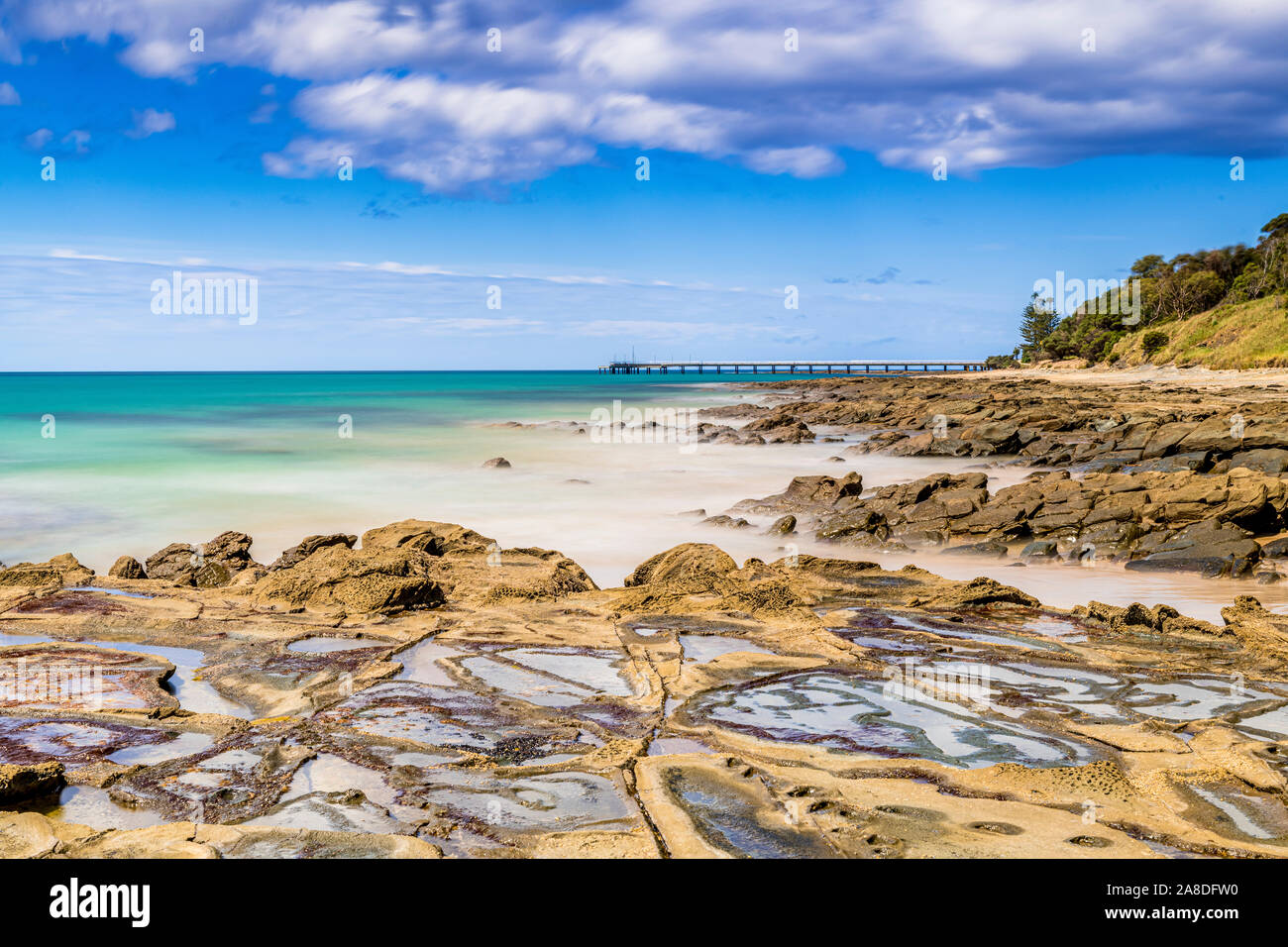The rocky shoreline surrounding the seaside town of Lorne, Victoria ...