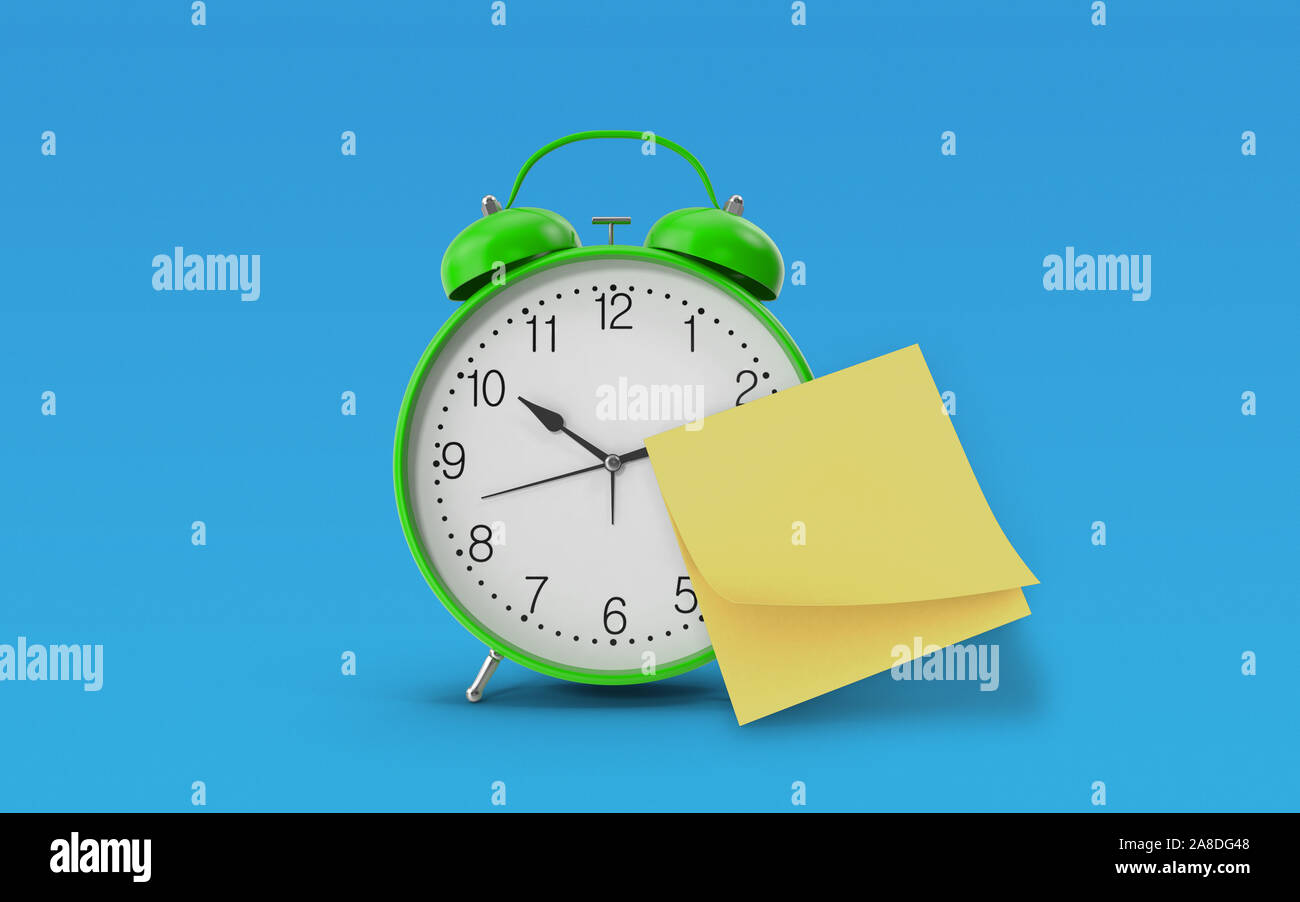 Empty sticky note paper attached to a green alarm clock on blue ...
