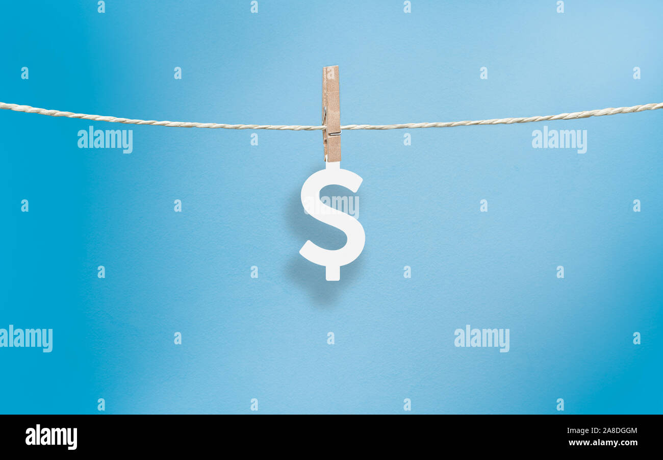 Cut out Dollar Sign in white cut out paper on blue background. High ...